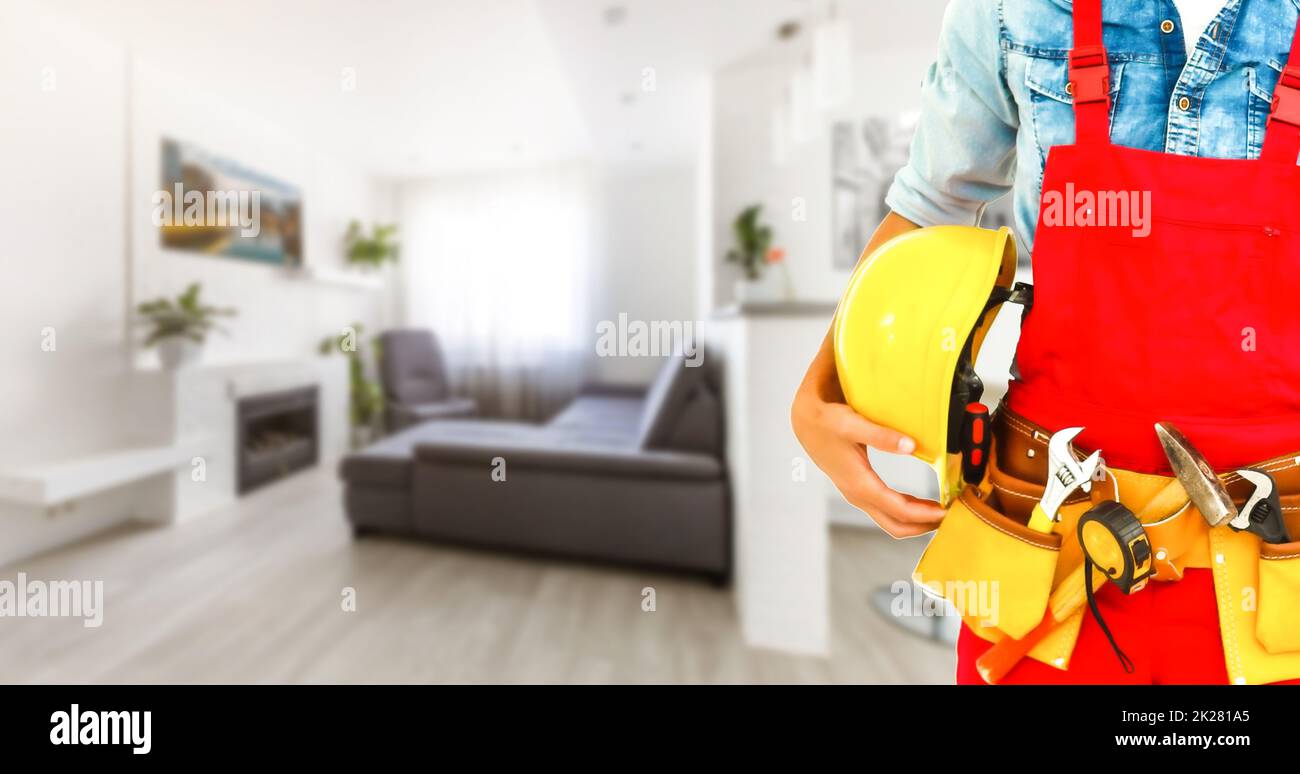 Builder handyman with construction tools. House renovation background ...