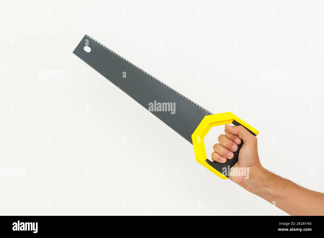 hand holding a saw isolated on white background Stock Photo - Alamy