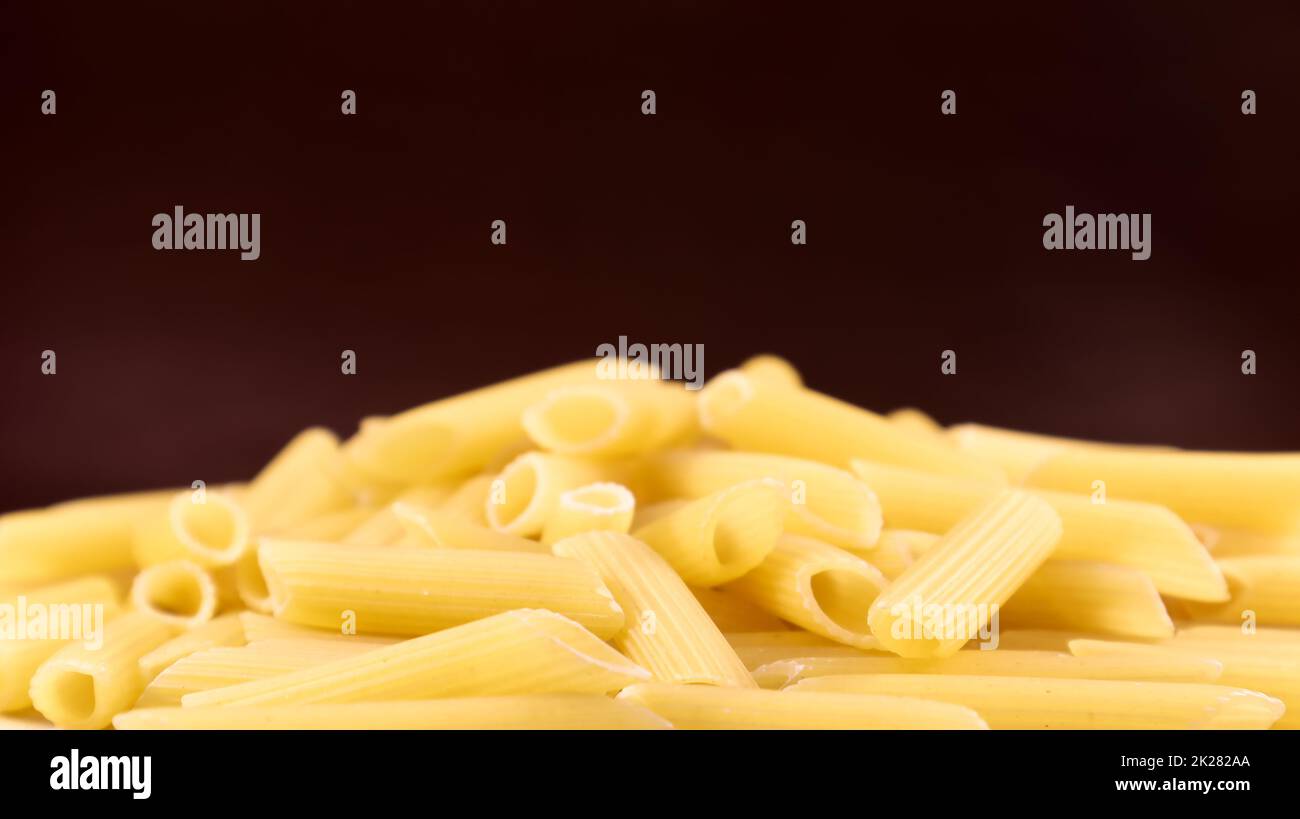 Penne Rigate Raw Pasta is a short pasta with oblique cuts and a ribbed ...