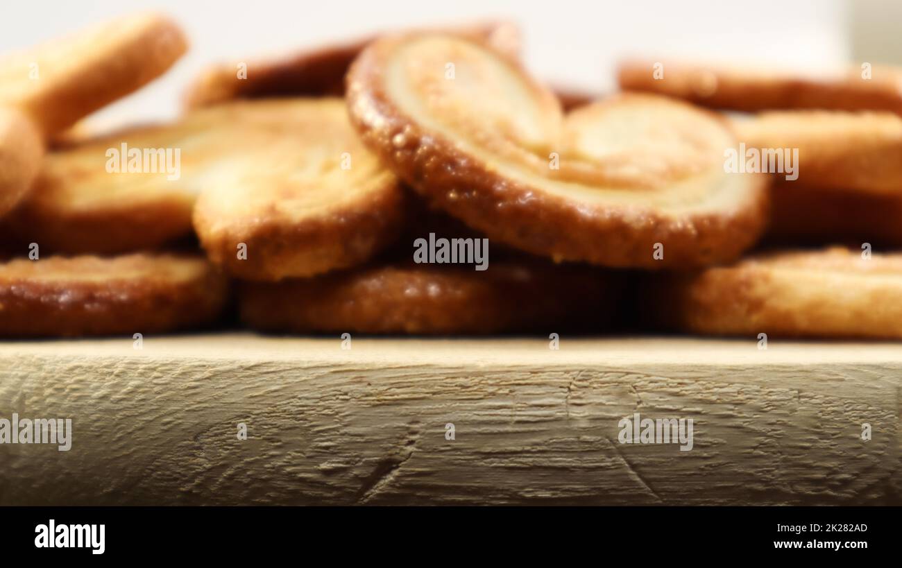 Fresh puff pastry palm cookies in the shape of a heart. Classic French ...