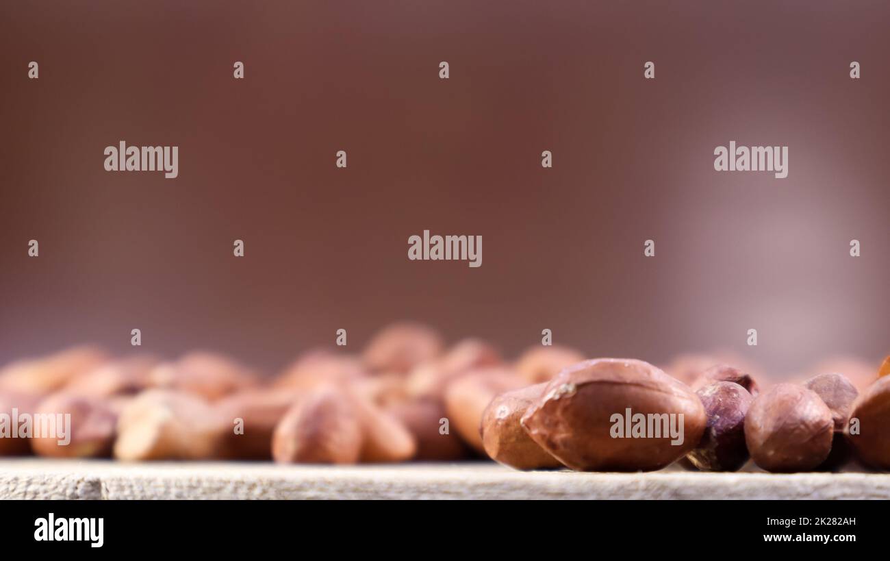 Heap of raw peanuts. Cultivated peanuts, underground or groundnuts ...