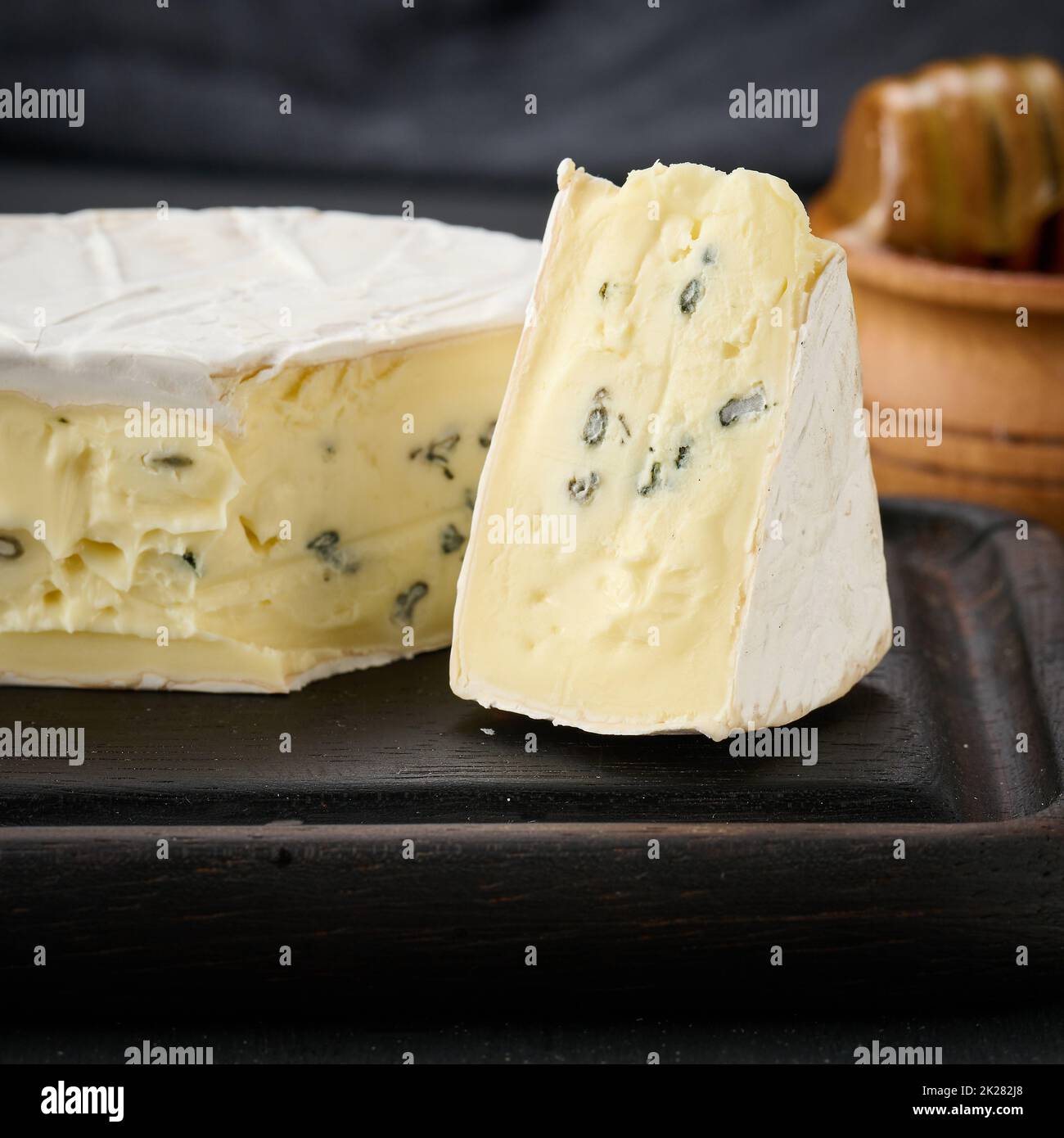 bergader blue cheese on a brown wooden board, delicious snack Stock ...