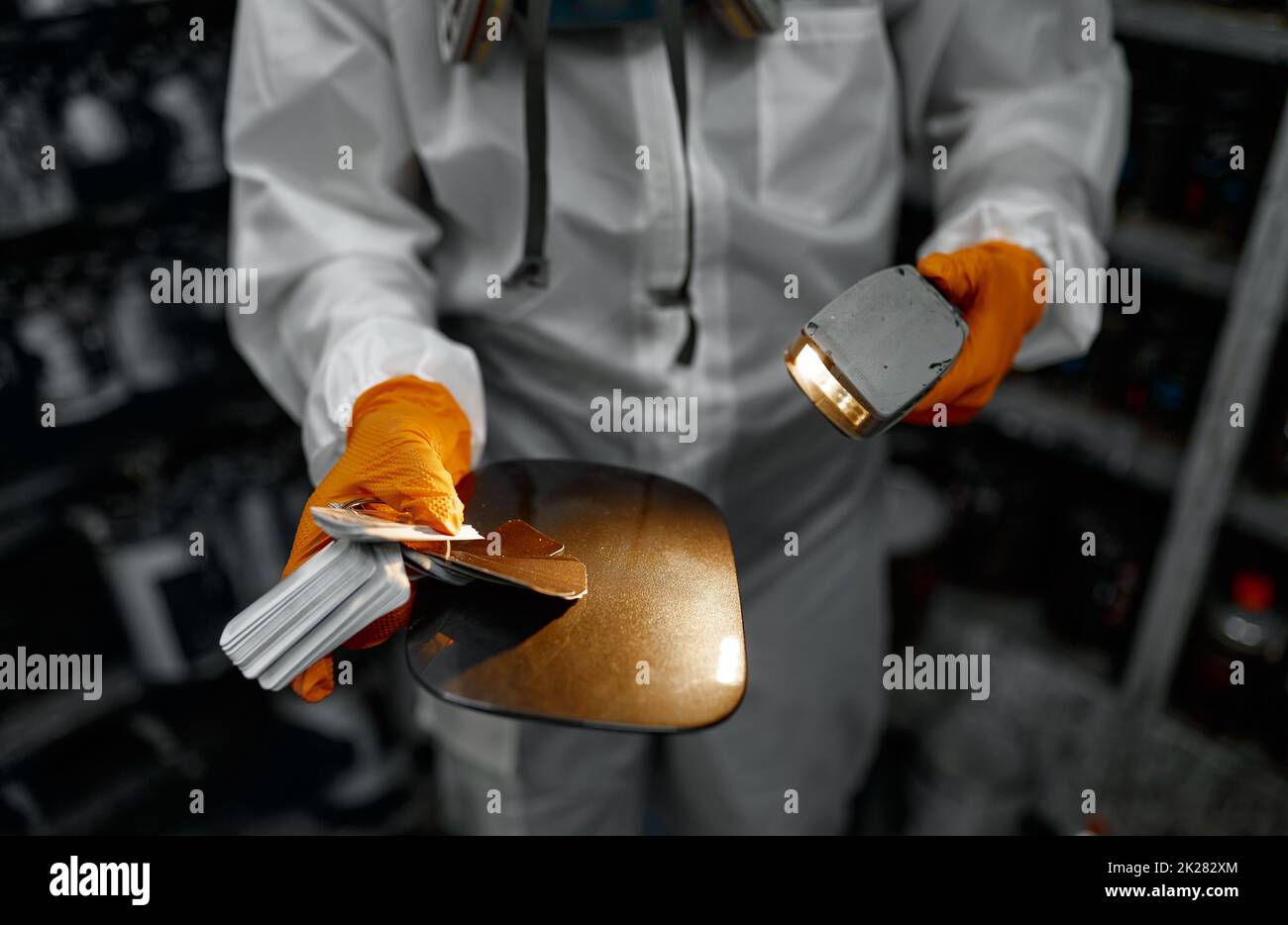 Painter hand holding paint test plate closeup Stock Photo - Alamy