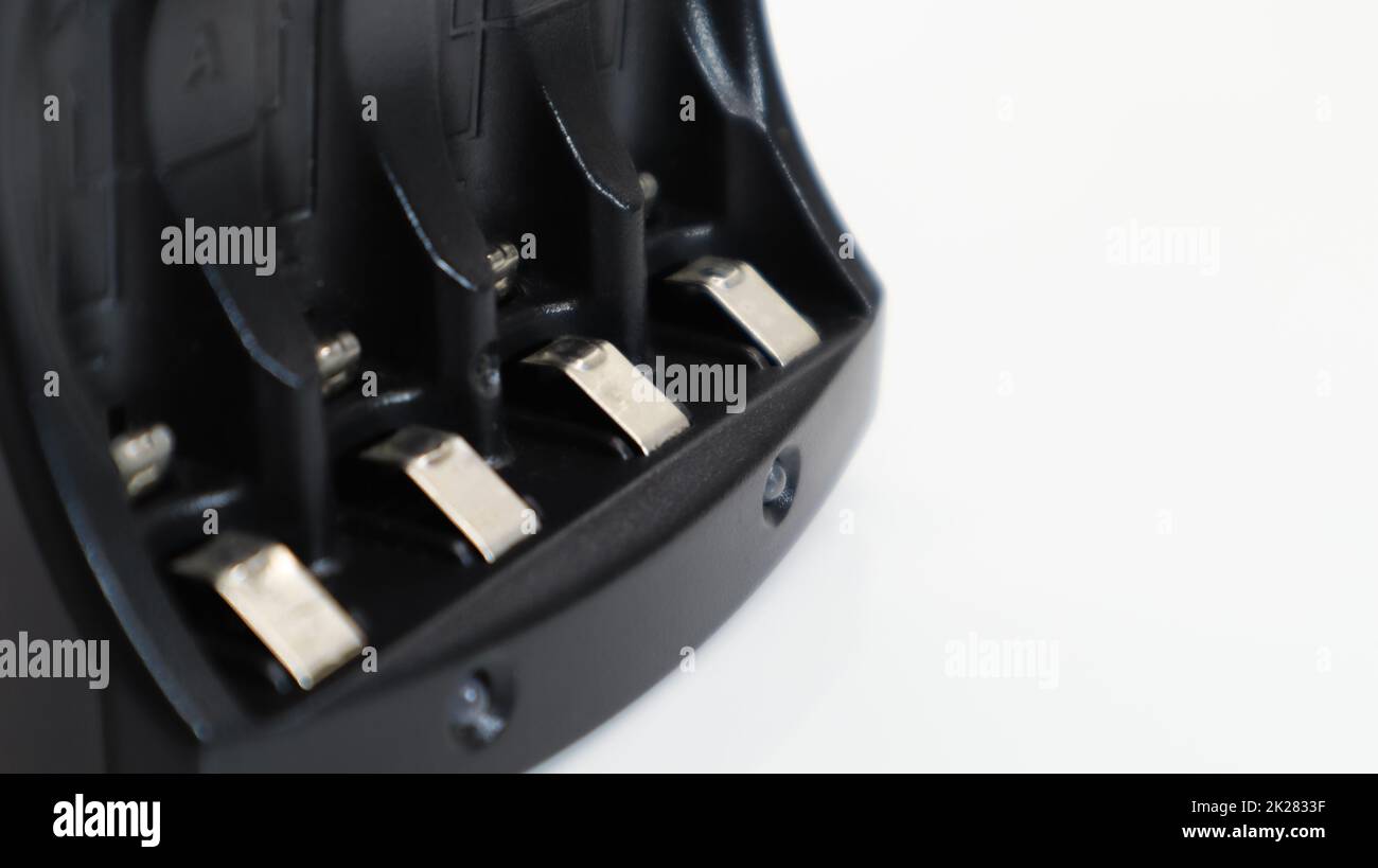 Fast charger for four AA rechargeable batteries in black on a white ...