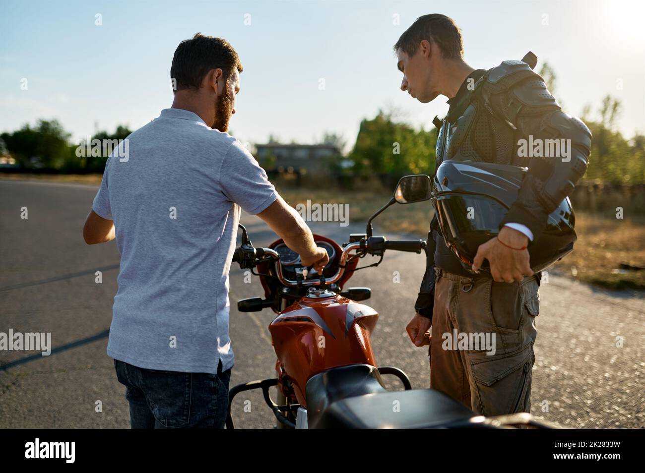 Male student and instructor, lesson in motorschool Stock Photo - Alamy