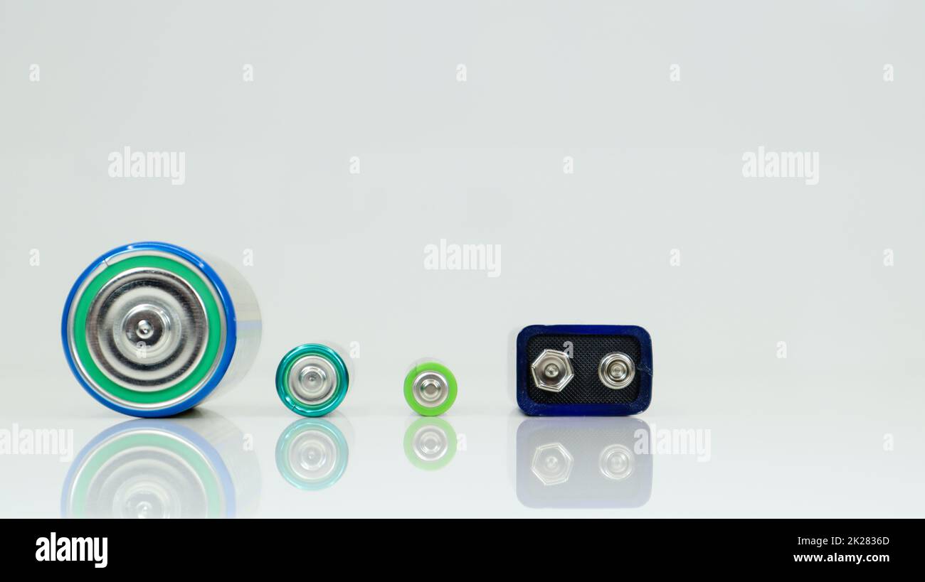 Battery type D or C, PP3, AA, AAA on a white background with reflection ...