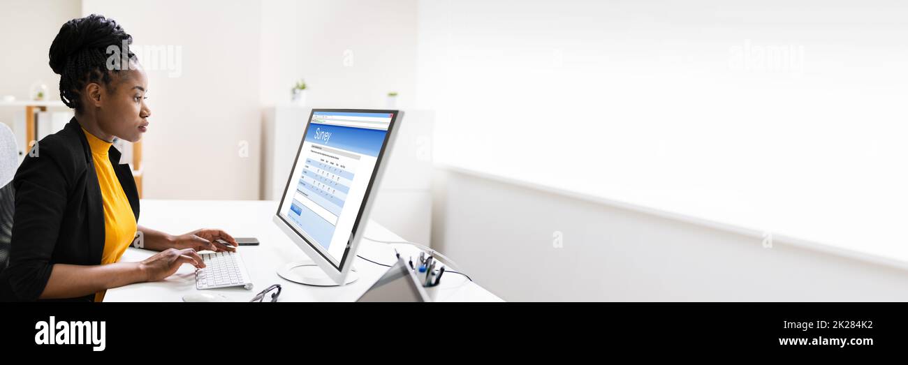 African Woman Filling Survey Poll Or Form Stock Photo - Alamy