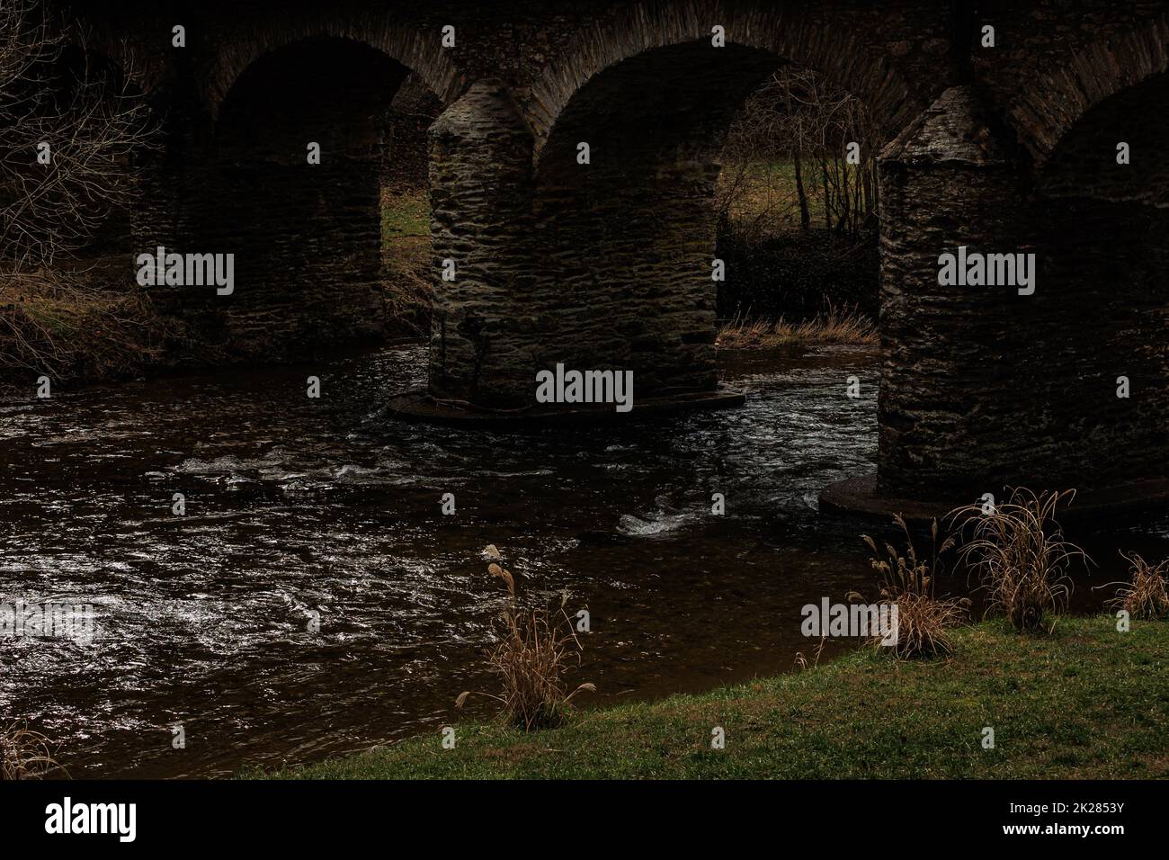 Dark Bridge with River Stock Photo - Alamy