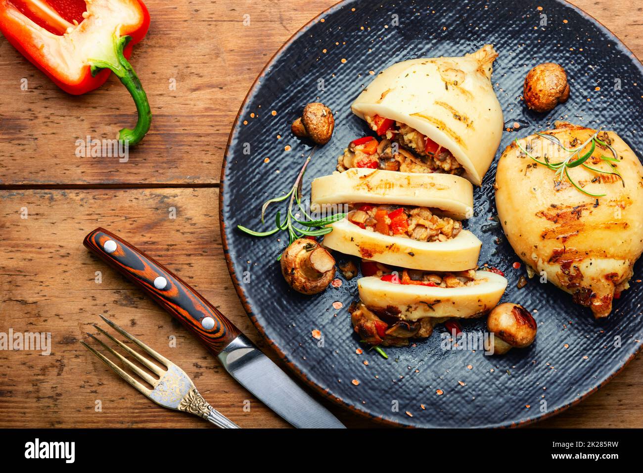 Grilled squid with mushroom stuffing Stock Photo - Alamy