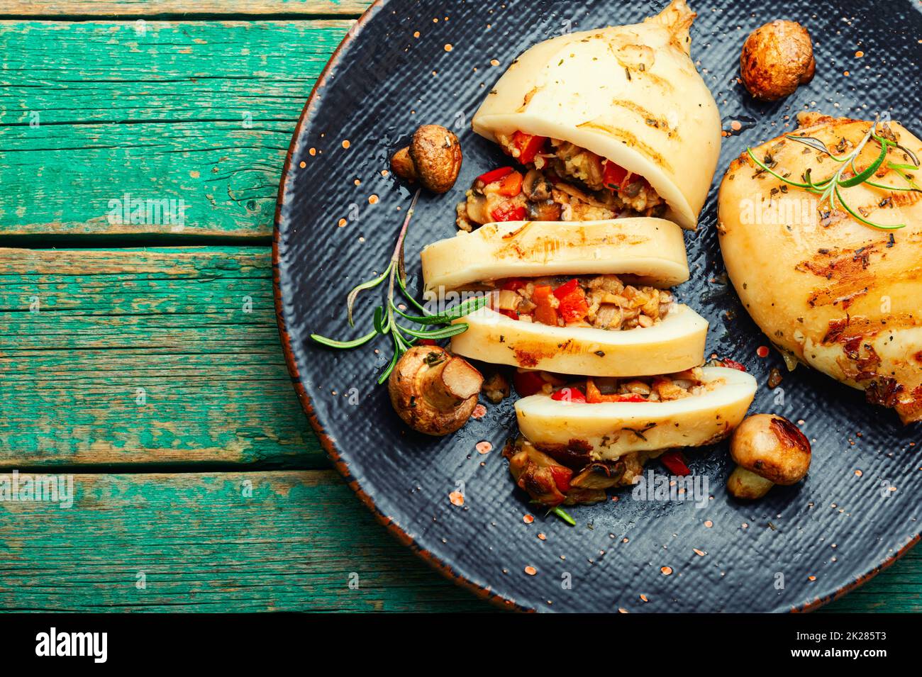 Grilled squid with mushroom stuffing Stock Photo - Alamy