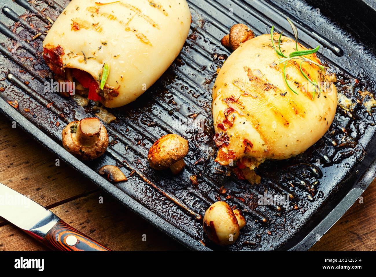 Grilled squid with mushroom stuffing Stock Photo - Alamy