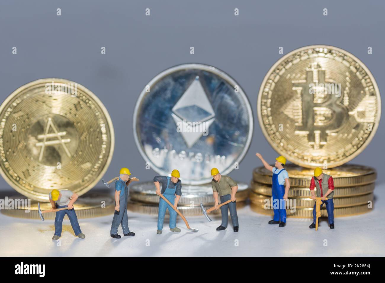 valueable crypto coins bitcoin ether and ad with many worker in a row ...