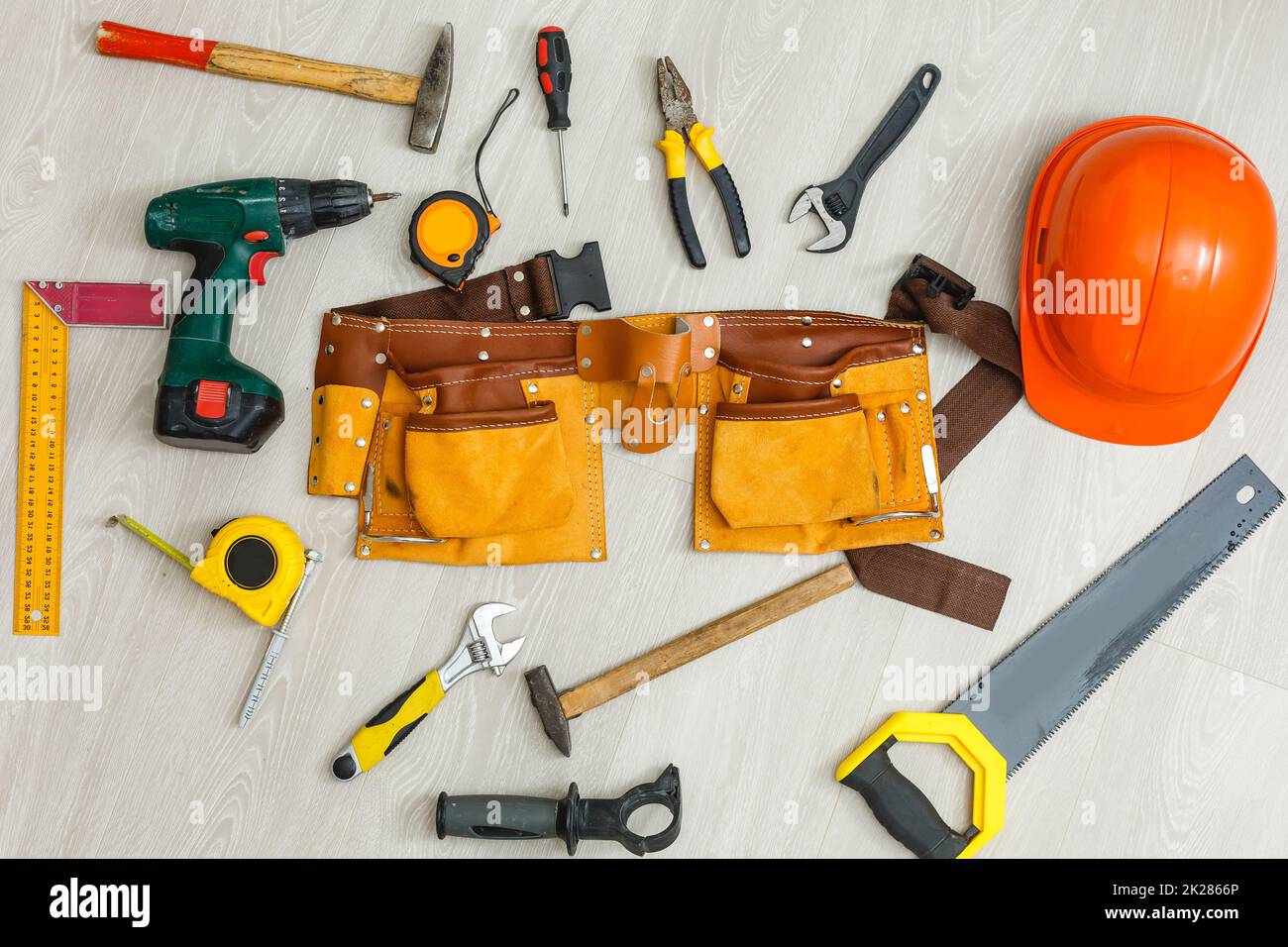 Engineered wooden flooring installation. Grey flooring with foam ...