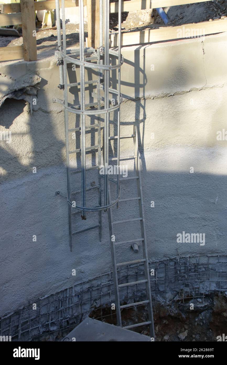 Ladder leading up from a pit Stock Photo - Alamy