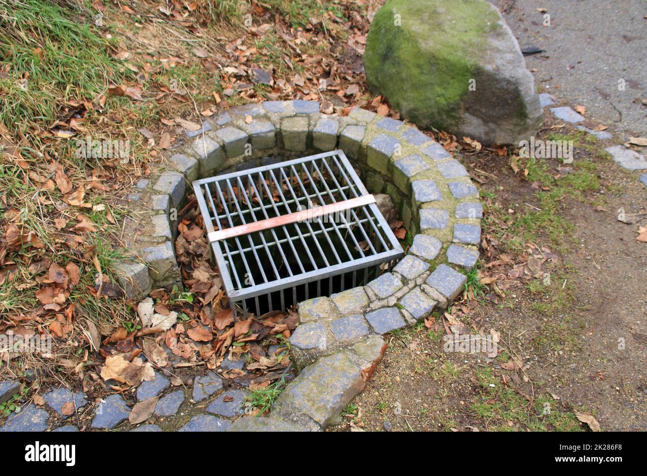 Inlet Shaft For Rainwater Made Of Paving Stones Covered With A Grid