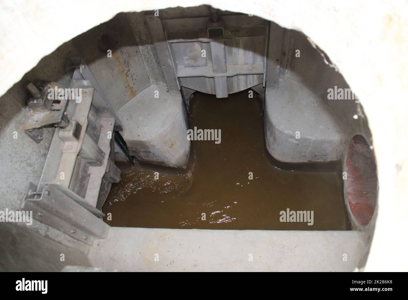 View from above into a sewer manhole Stock Photo - Alamy
