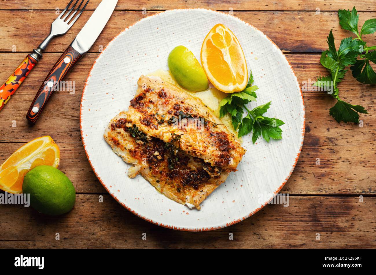 Fried fish fillets in orange oil Stock Photo - Alamy