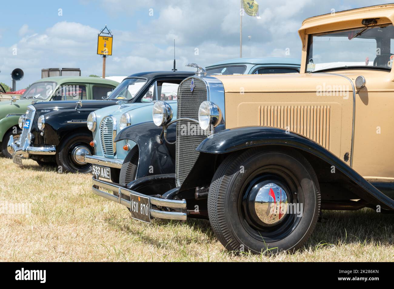 West Bay.Dorset.United Kingdom.June 12th 2022.A row of vintage cars are ...