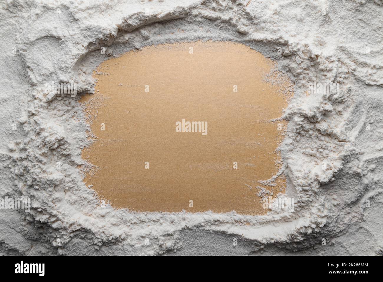 Flour or white powder background with golden copy space for text in the ...