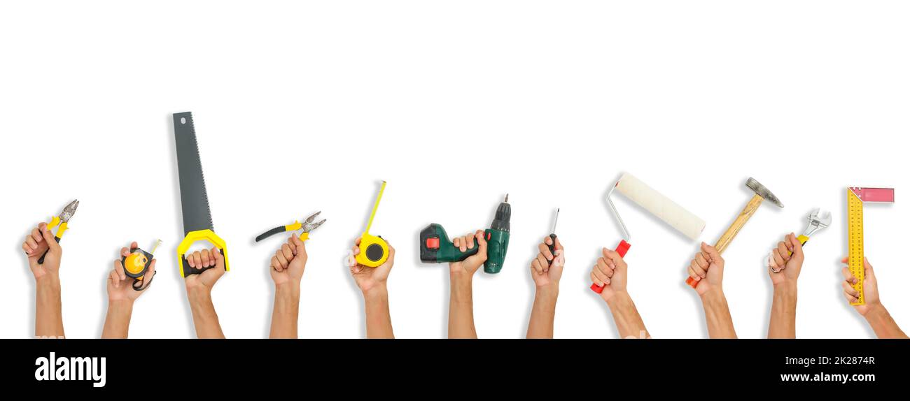 Hands holding hand tools isolated on white background Stock Photo - Alamy