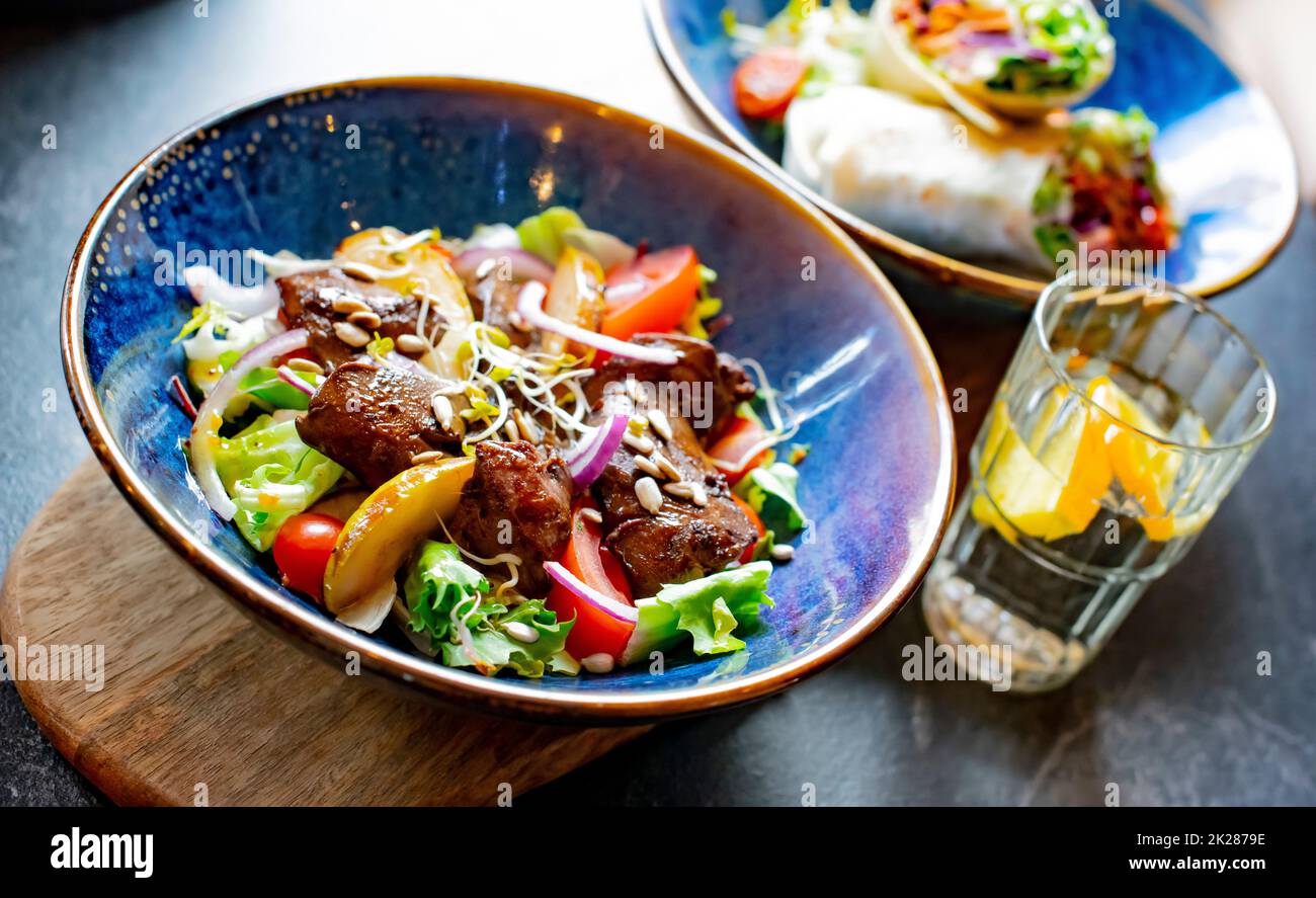 Vegetable salad with cooked pork and tortilla Stock Photo - Alamy
