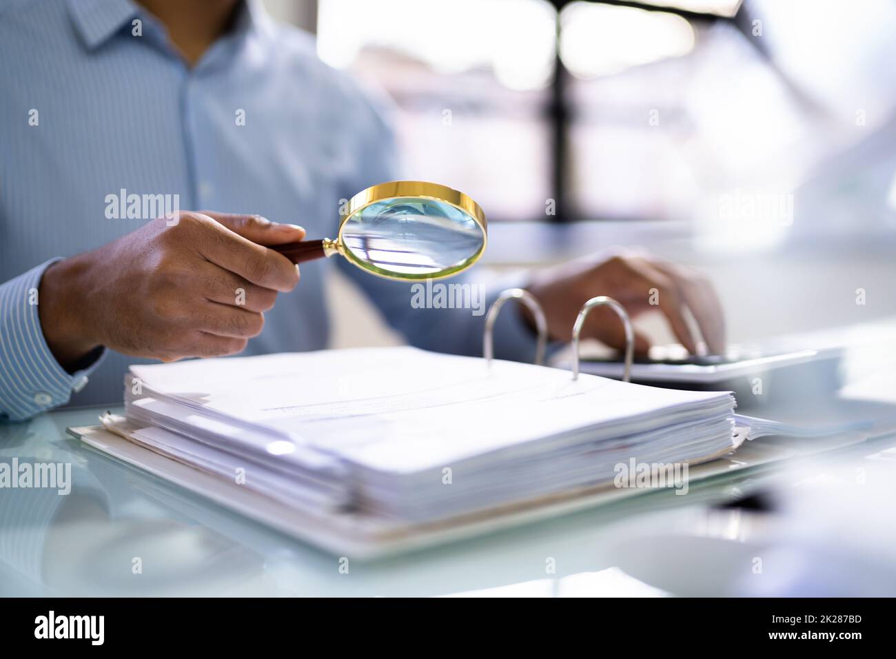 Auditor Using Magnifying Glass For Audit Stock Photo - Alamy
