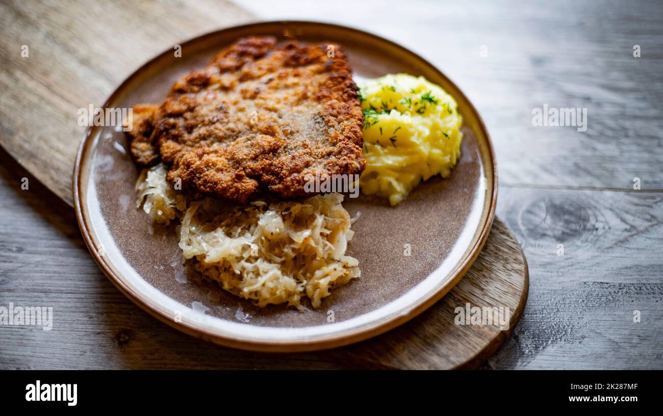 Pork breaded cutlet coated with breadcrumbs with mashed potatoes Stock ...