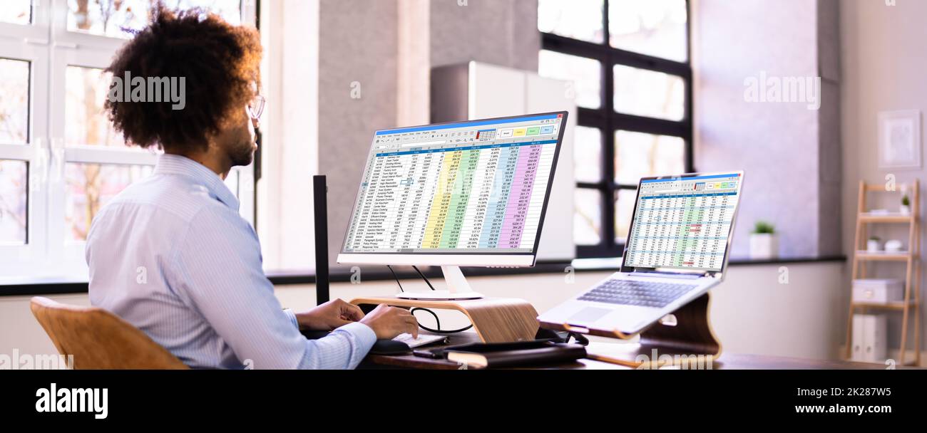 African Man Using Spreadsheet Accounting Software Stock Photo - Alamy