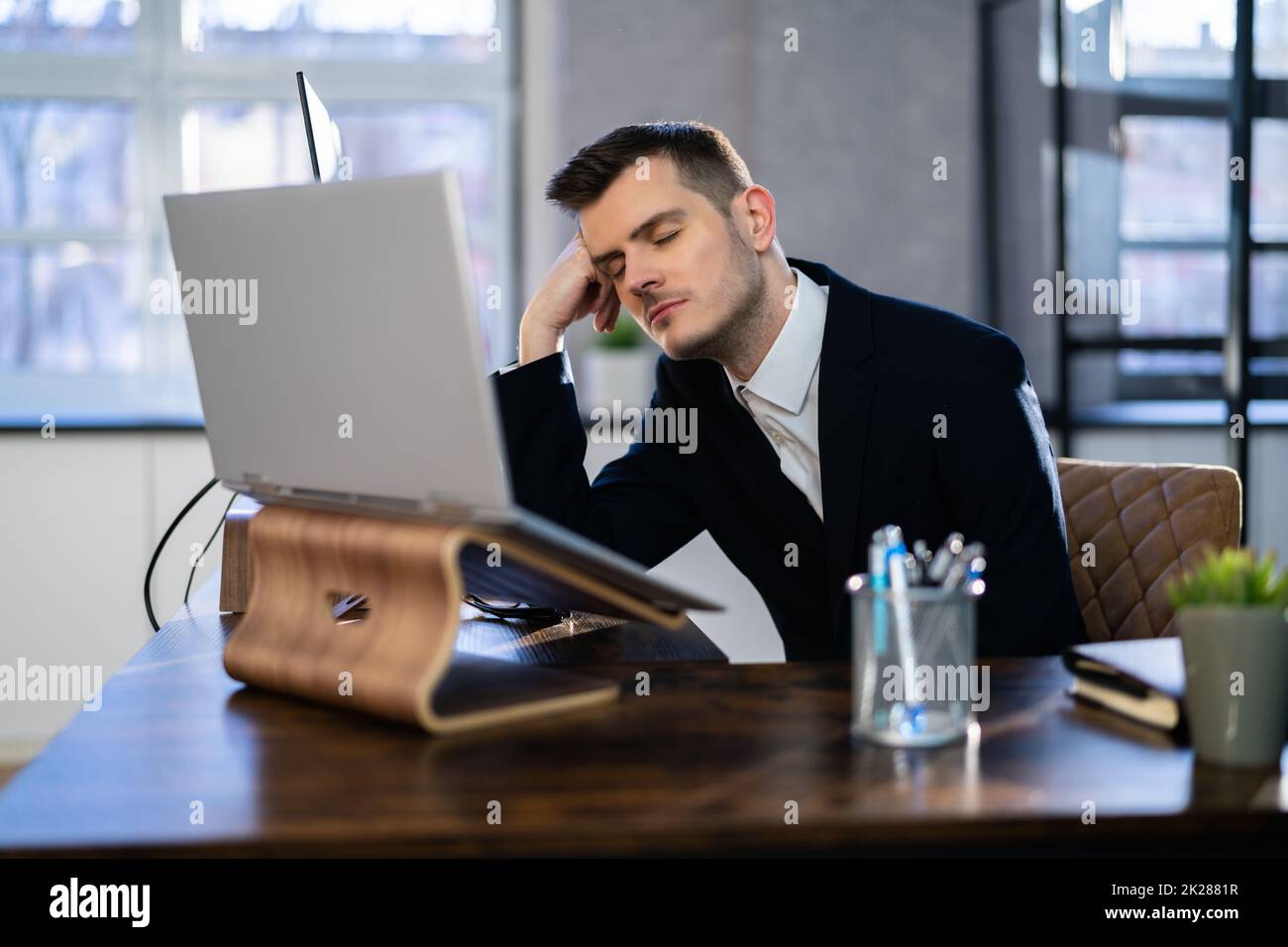 Bored Boss Man Sleeping Stock Photo - Alamy