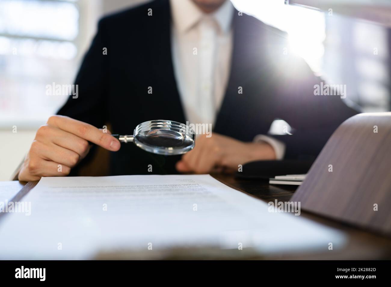 Lawyer Examining Paper Using Magnifier Glass Stock Photo - Alamy