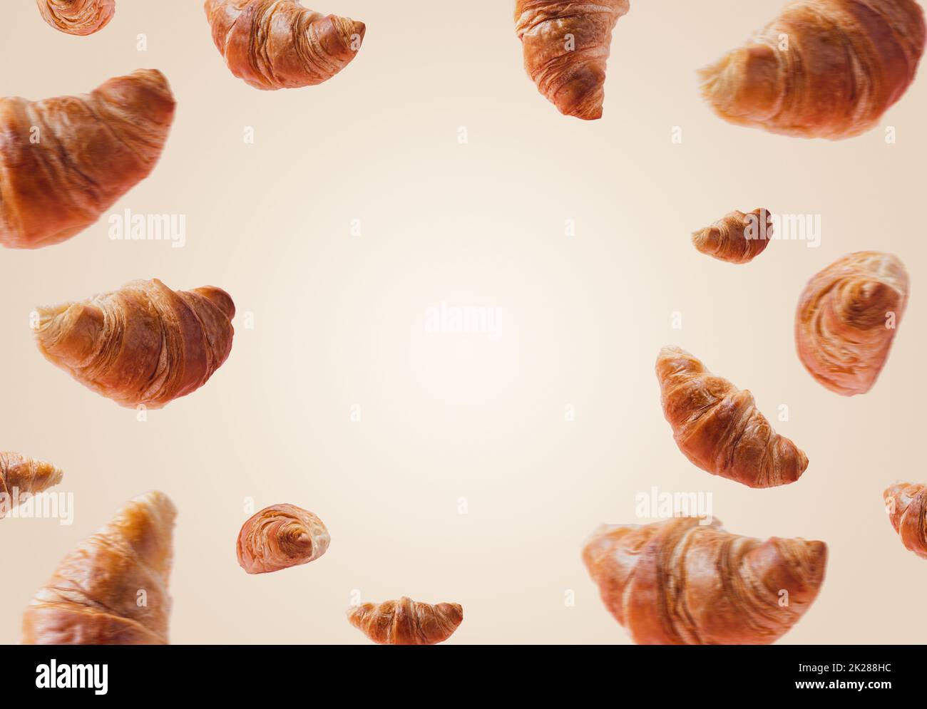 Croissants levitating or flying on white beige background. Levitation ...