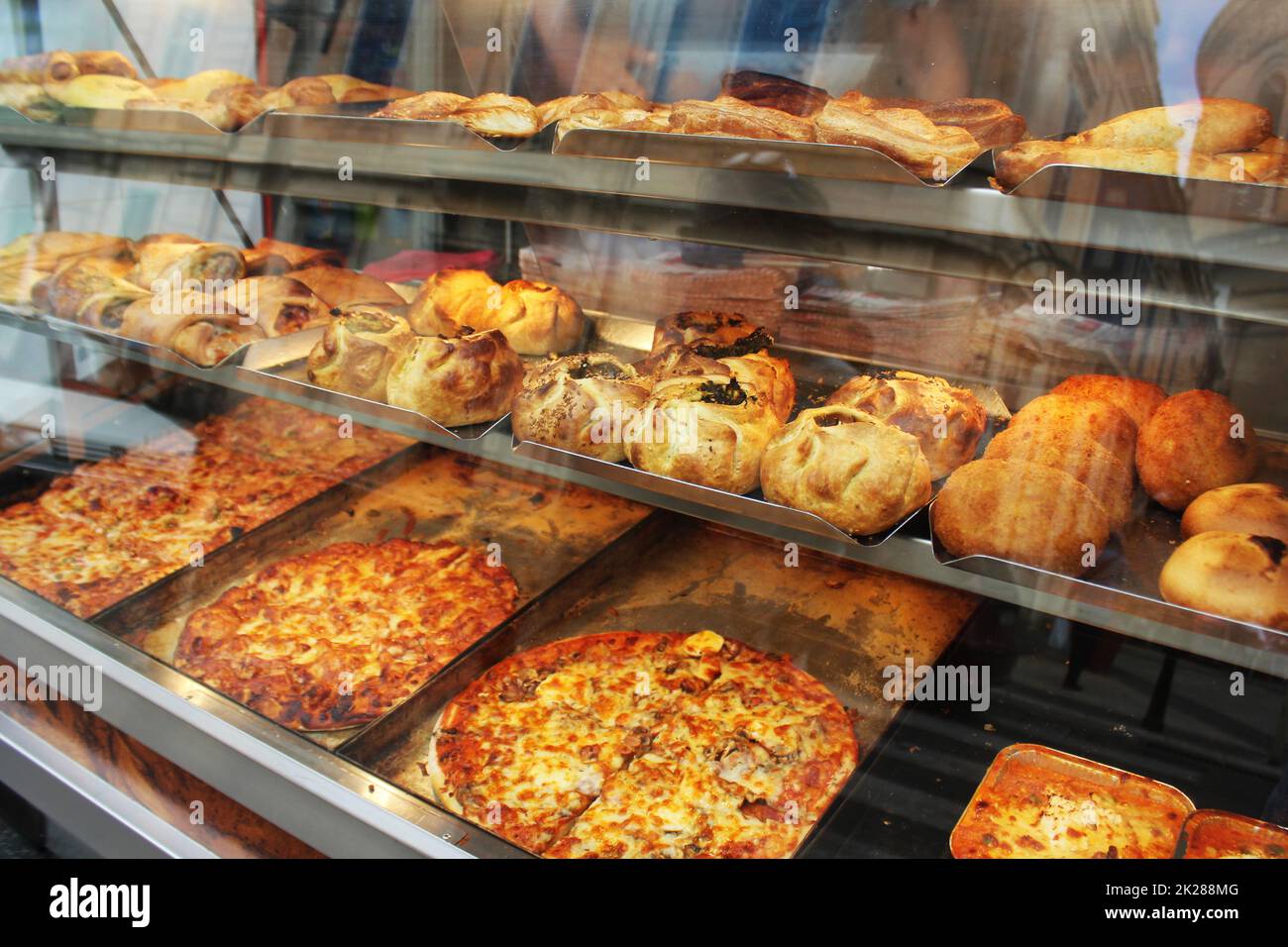 Traditional savoury pastry with filling. Fresh pastizzi and snacks for ...