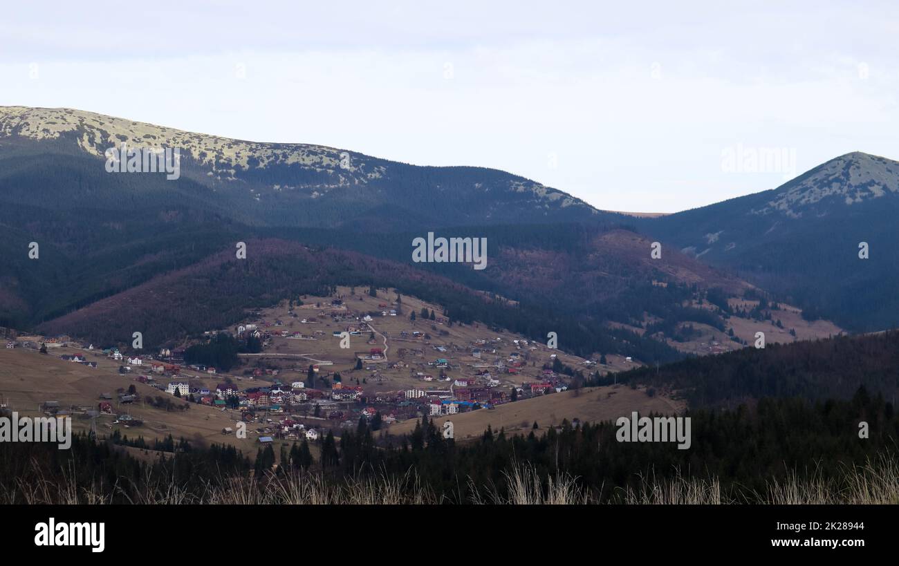 Colorful autumn landscape in a mountain village. Misty morning in the ...