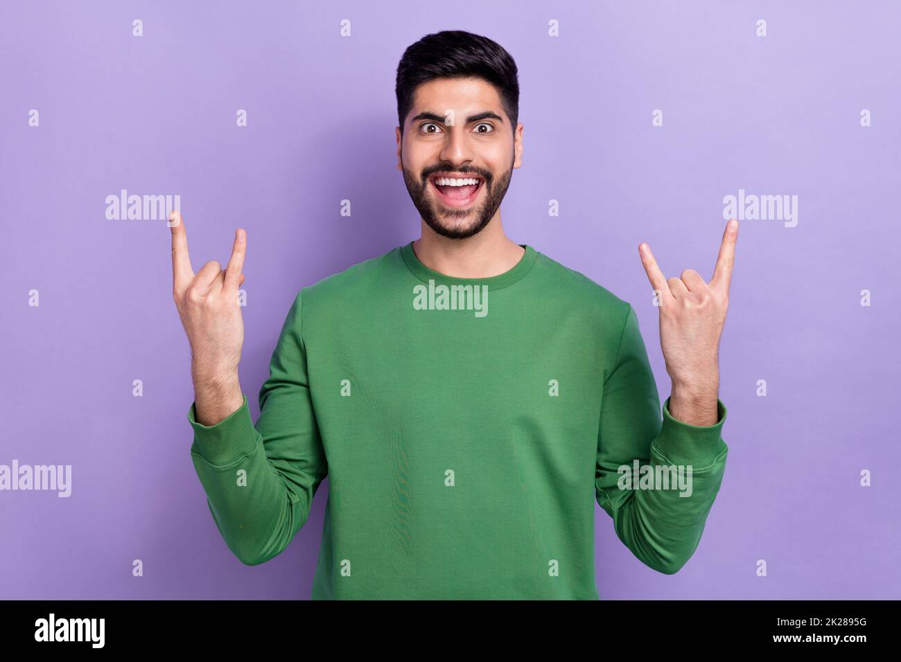 Photo of handsome stylish impressed careless guy wear green pullover ...
