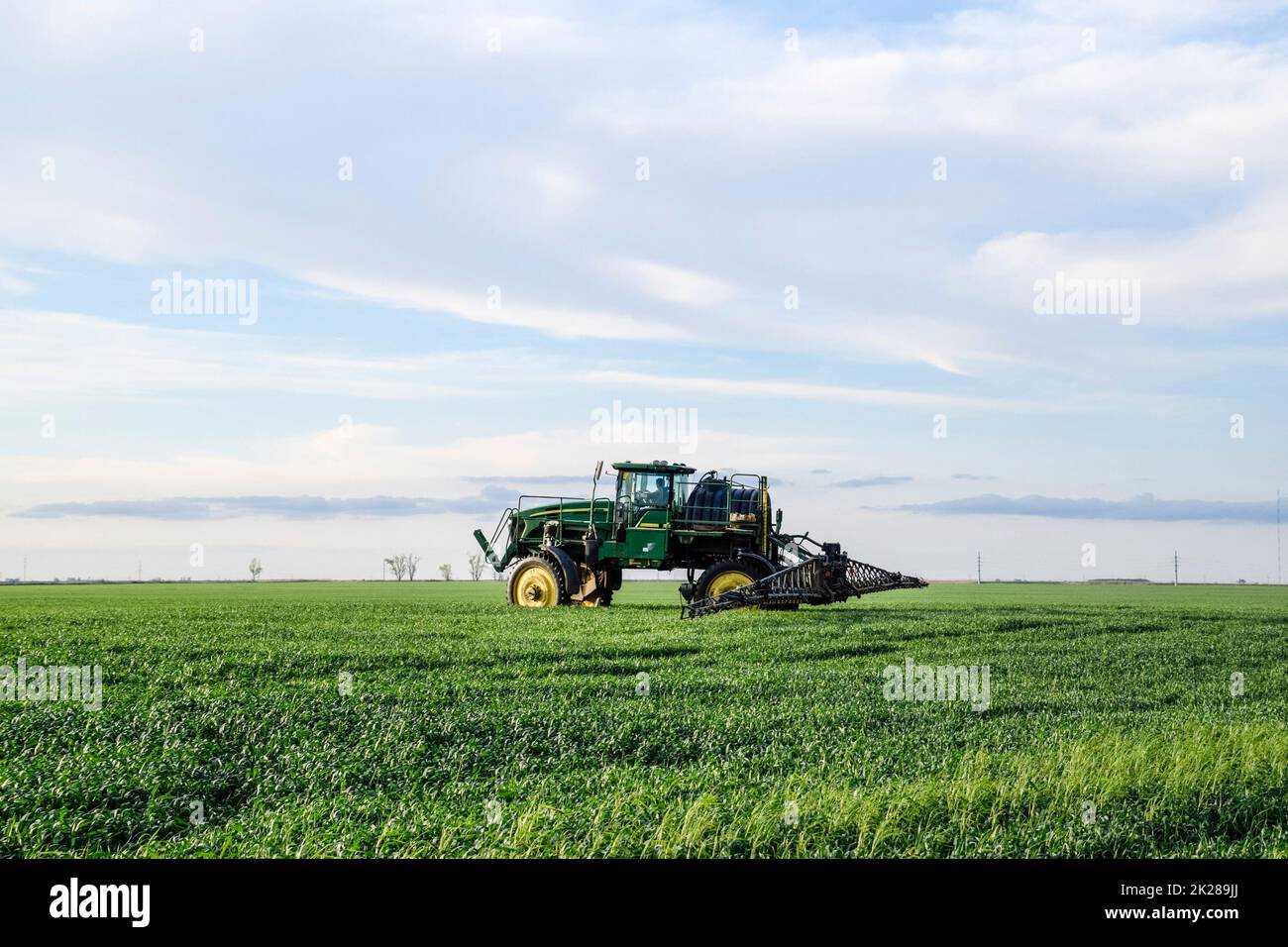 Tractor with a spray device for finely dispersed fertilizer. Tractor on ...