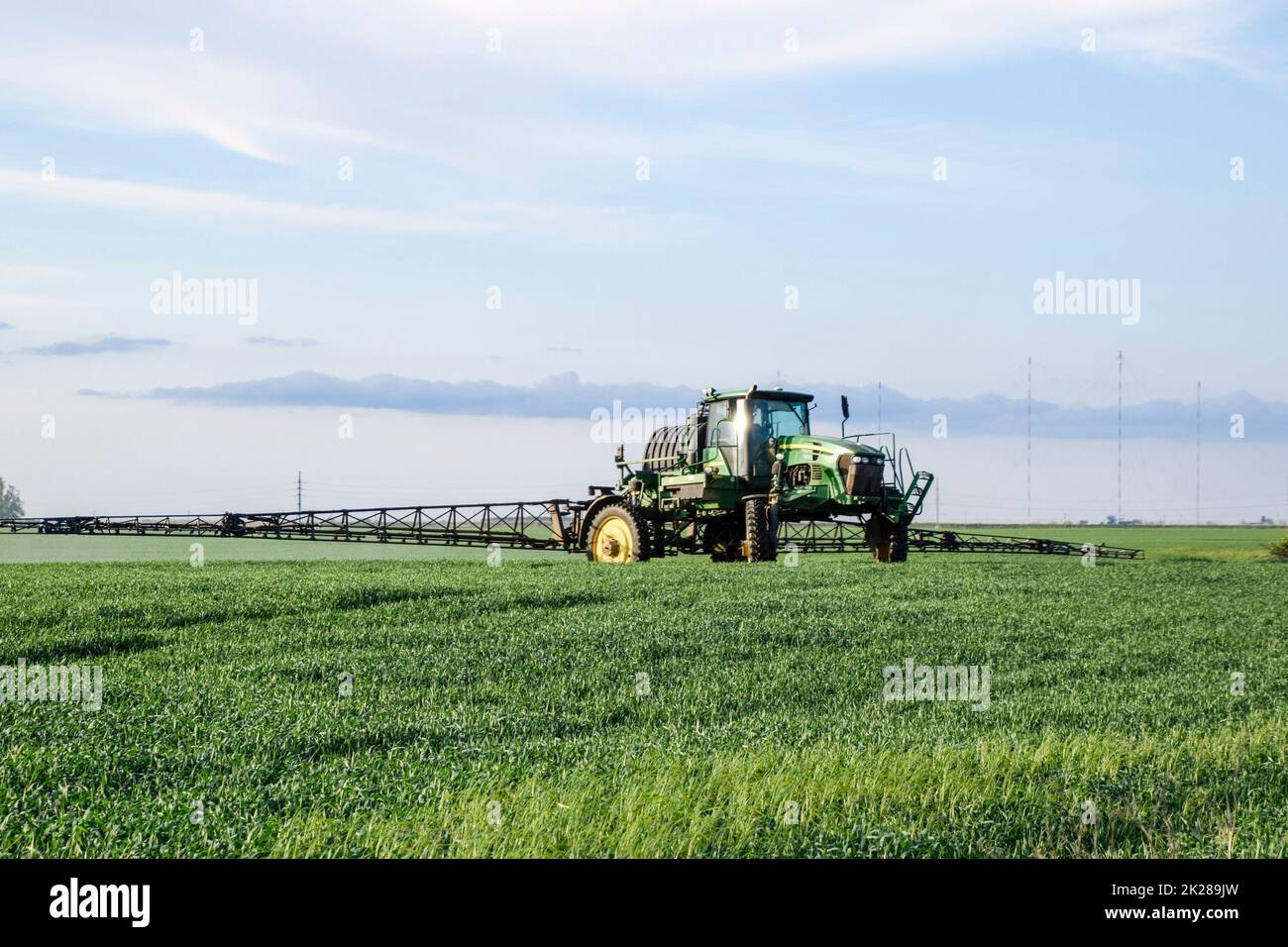 Tractor with a spray device for finely dispersed fertilizer. Tractor on ...