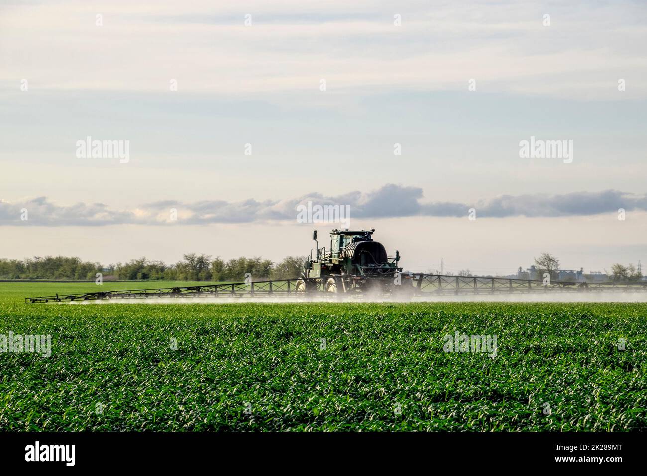 Tractor with a spray device for finely dispersed fertilizer. Tractor on ...