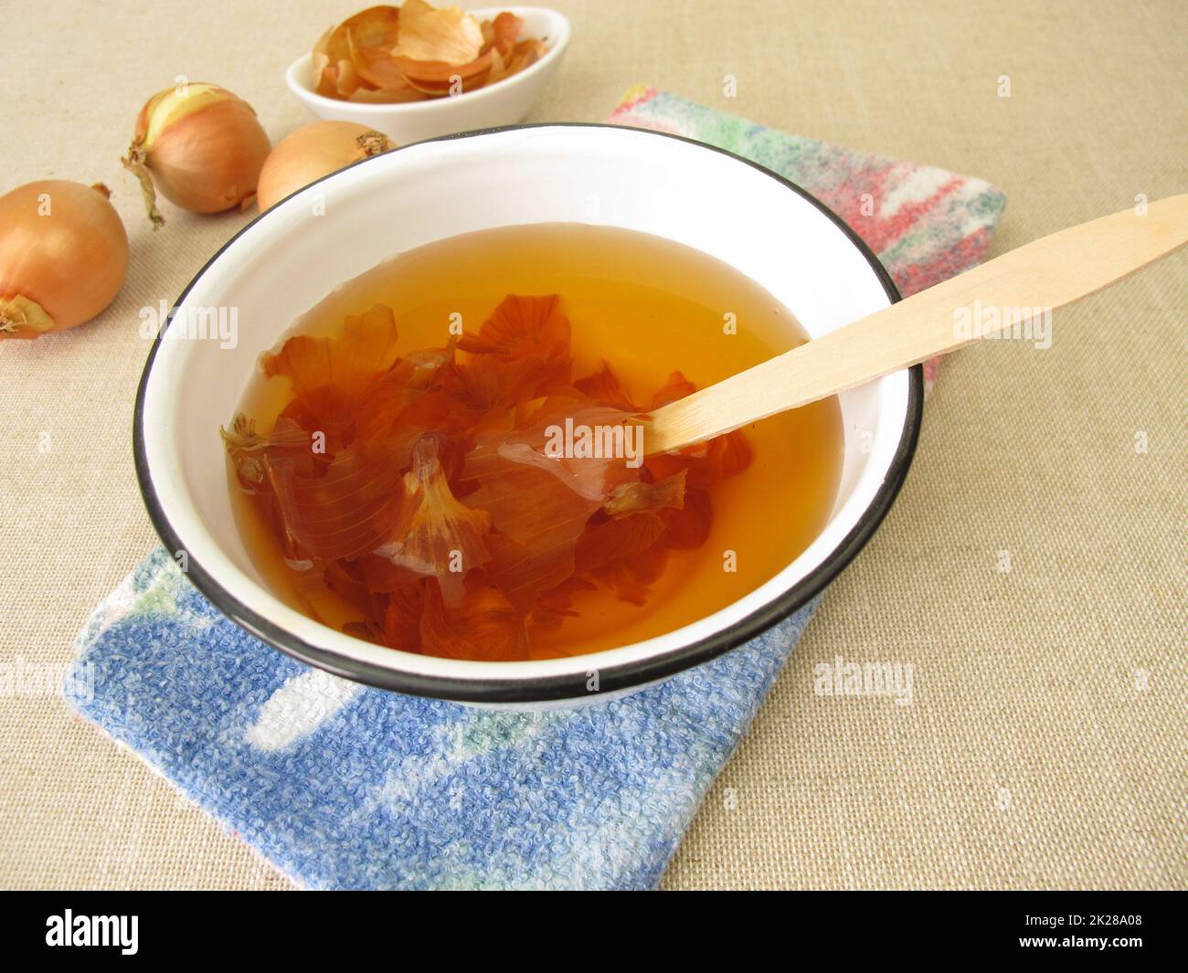 Dye agent, brown decoction from onion peel Stock Photo - Alamy