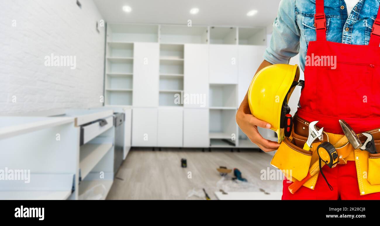 Builder handyman with construction tools. House renovation background ...