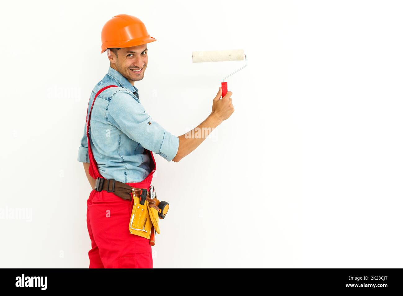 Handyman isolated over white background. House renovation Stock Photo ...