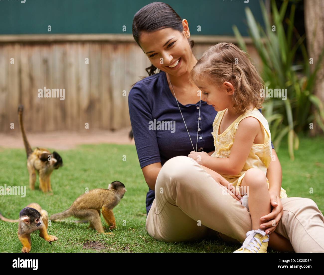 Teaching her the importance of animal conservation. a young mother and ...