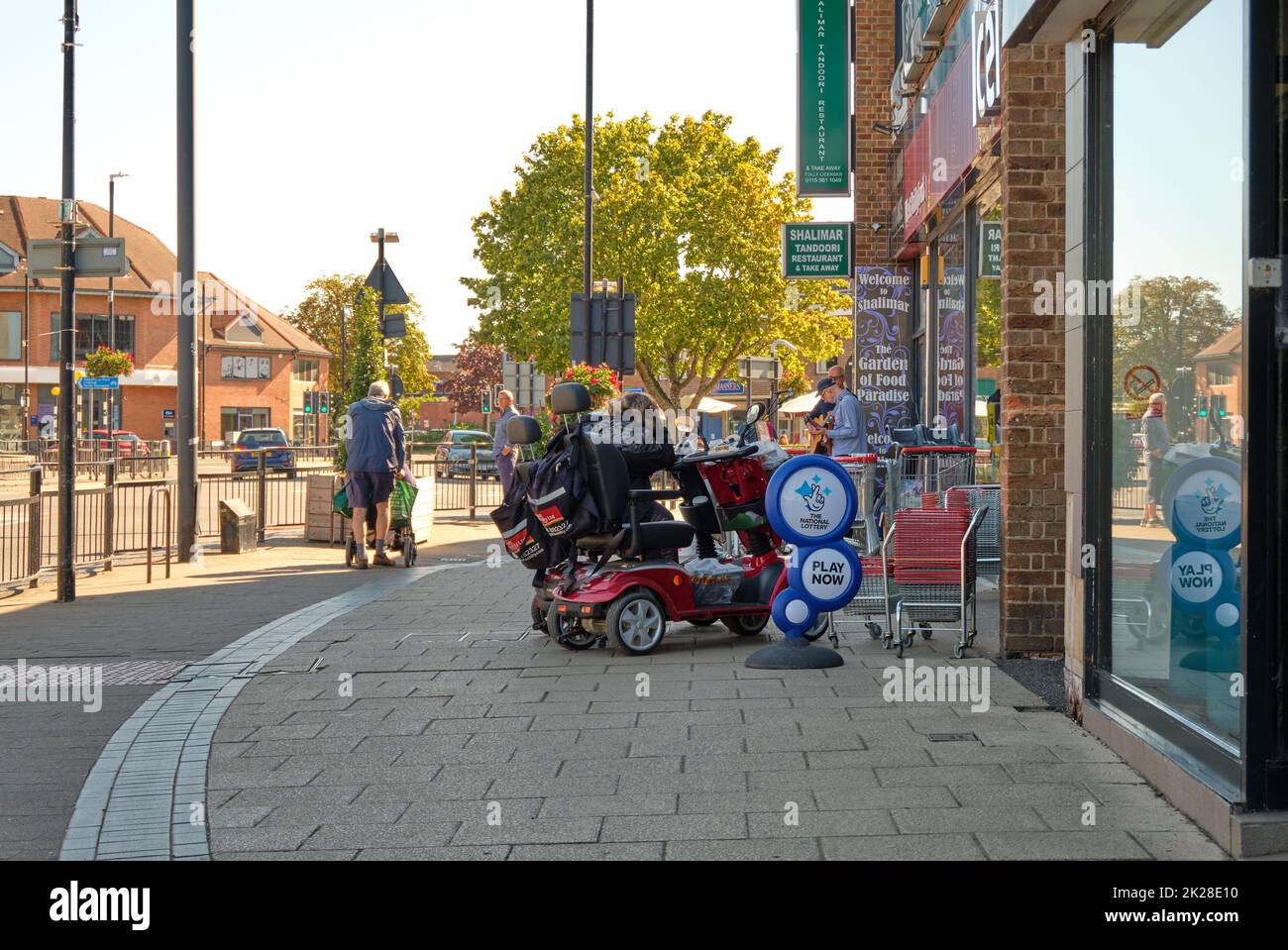 Mobility scooter on a high street pavement in West Bridgford ...