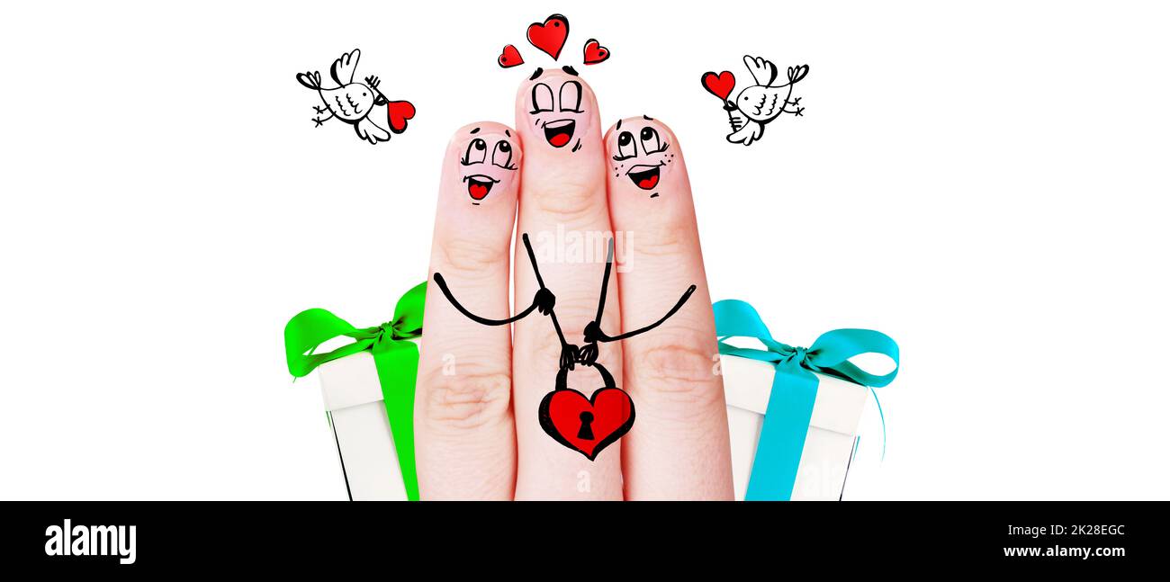 Finger puppets of loving parents with young child hugging and having ...