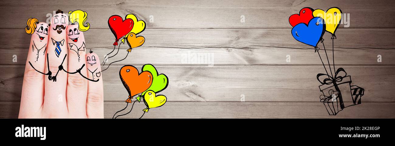 Finger puppets of loving parents with young child hugging and having ...