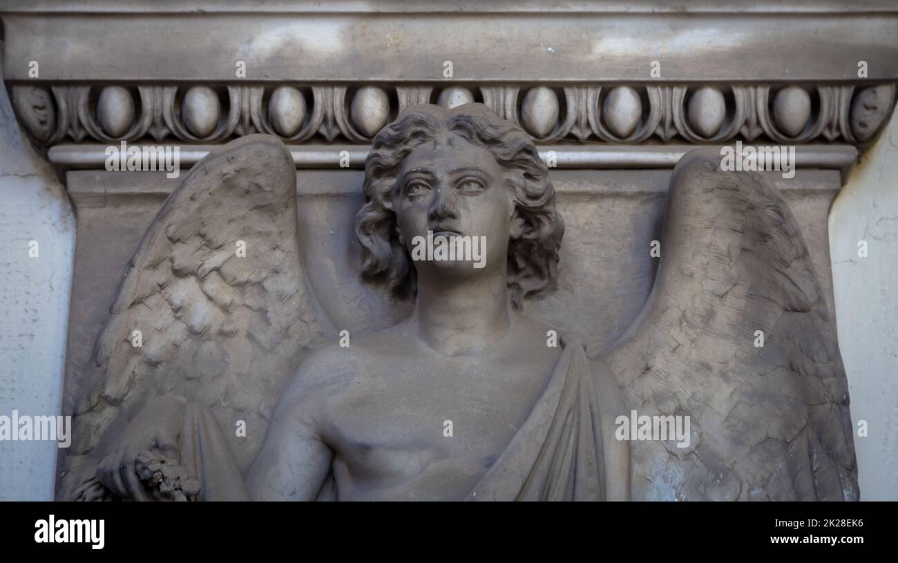 Statue of angel on an old tomb located in Genoa cemetery - Italy Stock ...