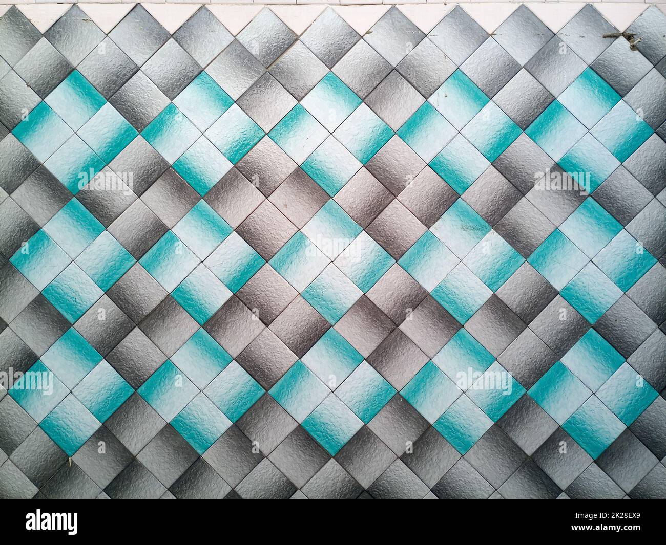 Old tile on the wall. The background texture of tile is blue and grey ...