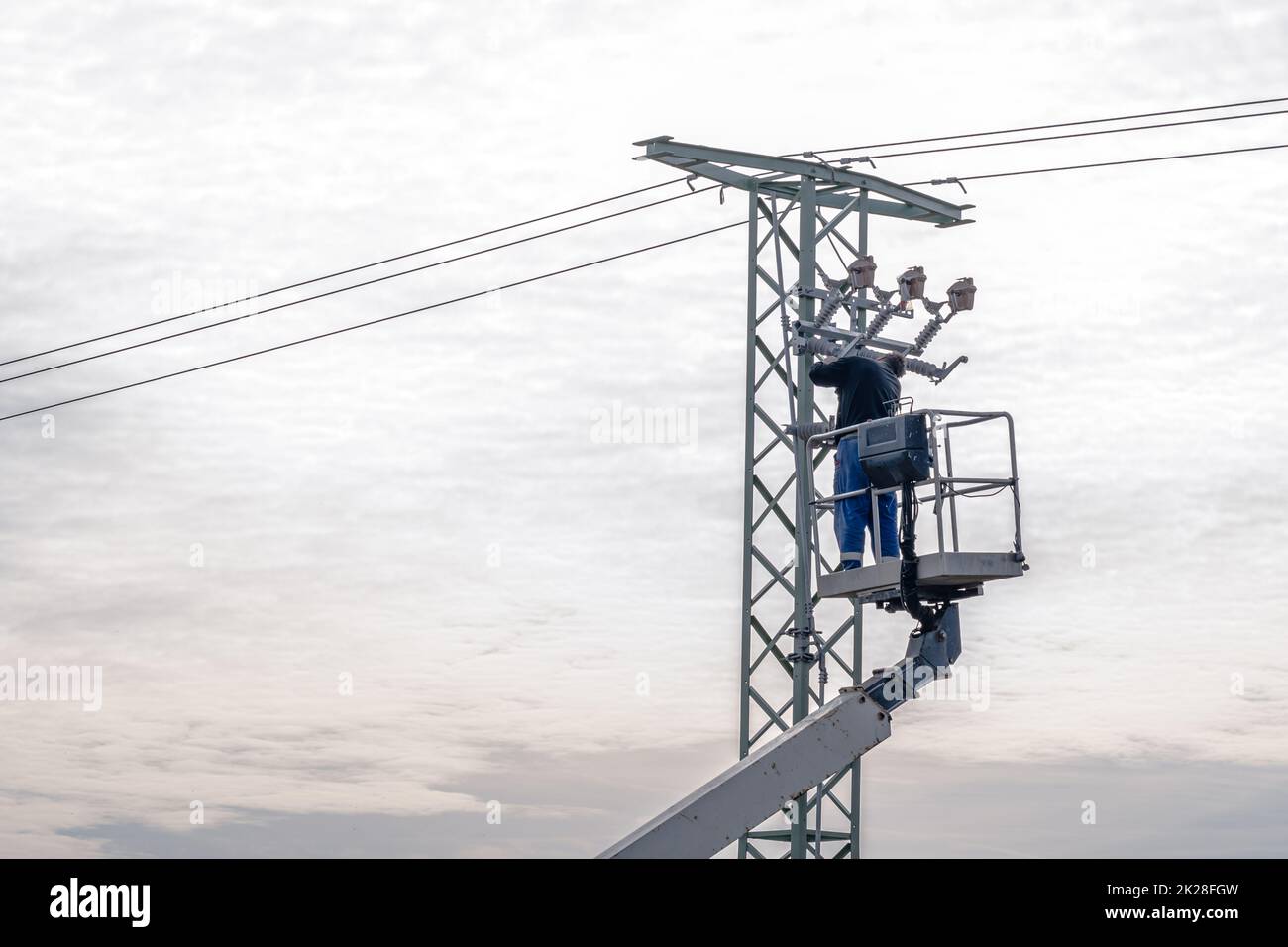 repair of high voltage power line on the pole Stock Photo - Alamy