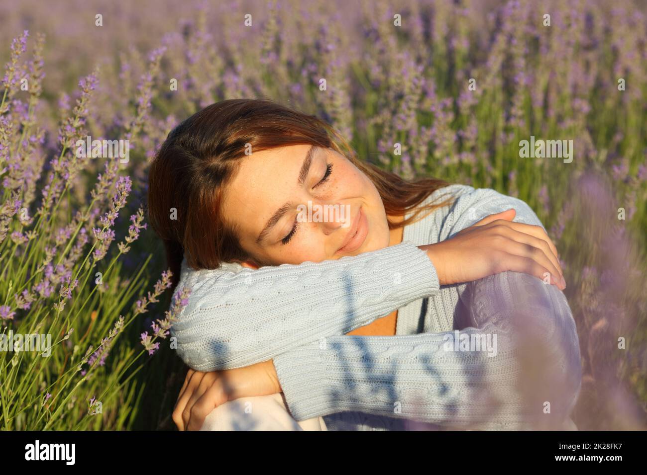 Woman relaxing with closed eyes in lavender field Stock Photo - Alamy
