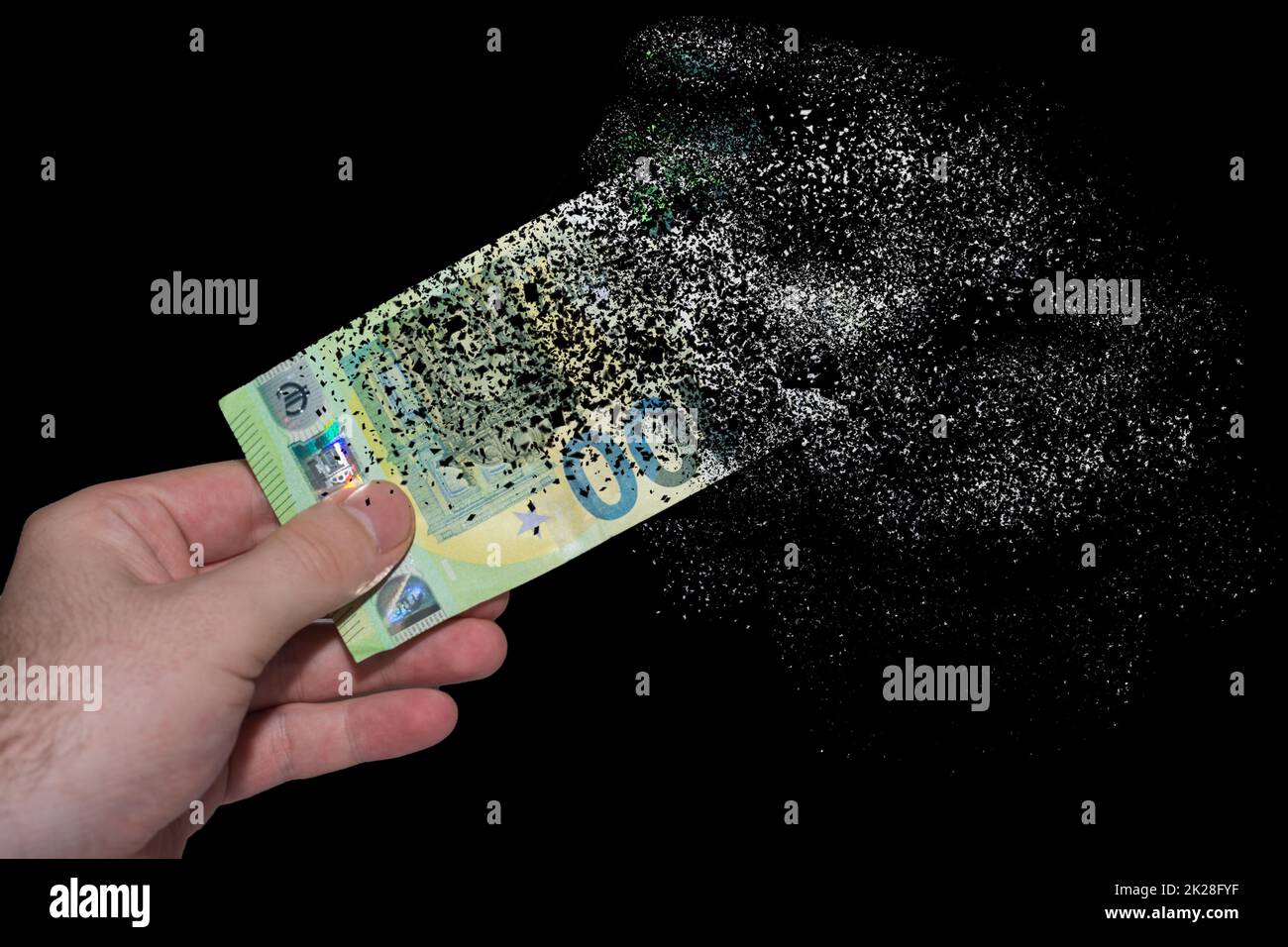 single euro bank note held in one hand decomposes and dissolves due to ...