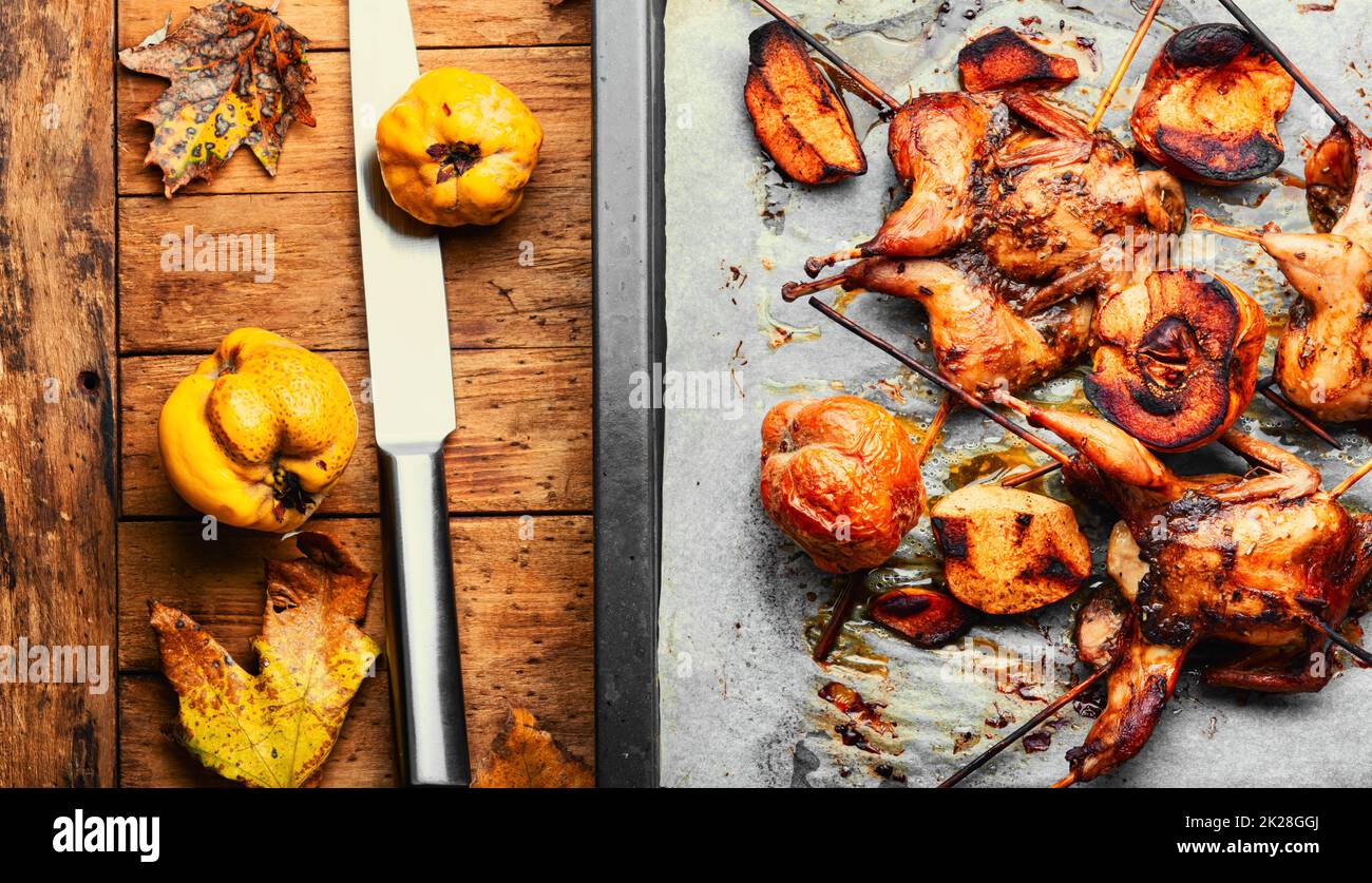 Quail barbecue with quince Stock Photo - Alamy